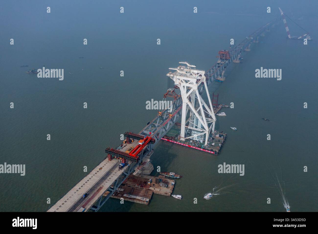 An aerial view of the final span being installed on pillars 12 and 13 ...
