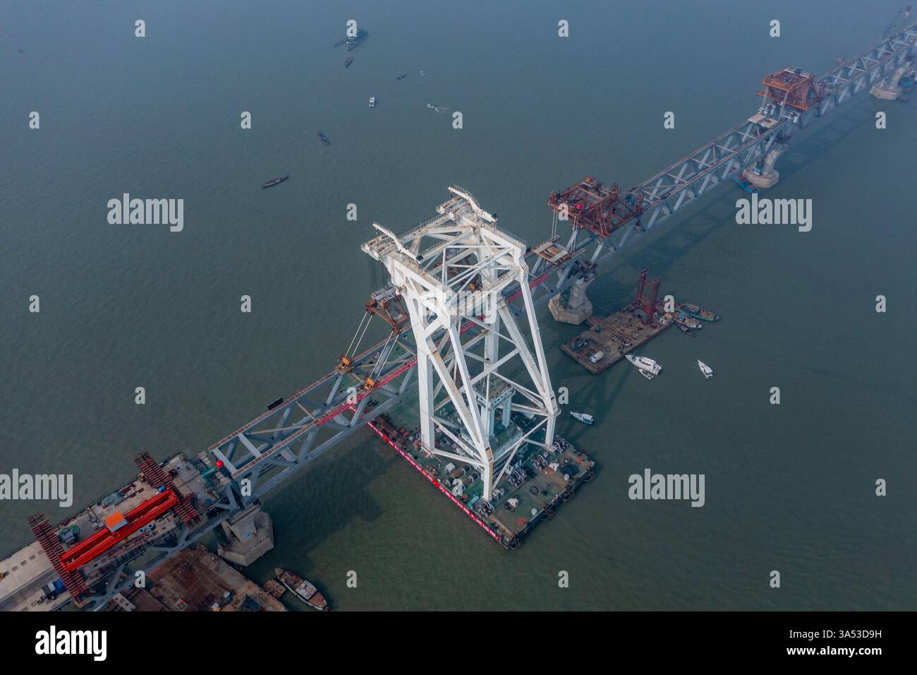 An aerial view of the final span being installed on pillars 12 and 13 ...