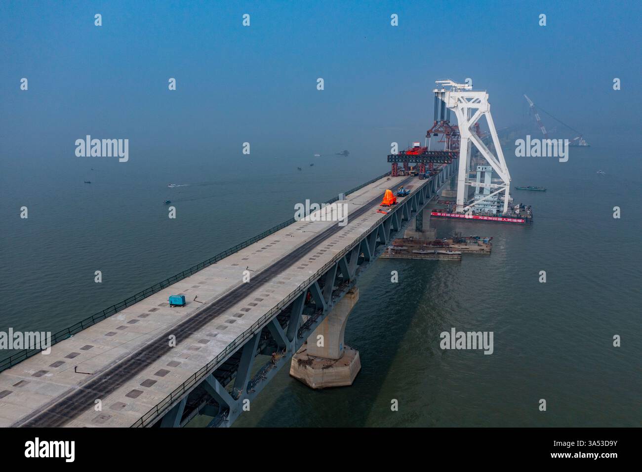 An aerial view of the final span being installed on pillars 12 and 13 ...