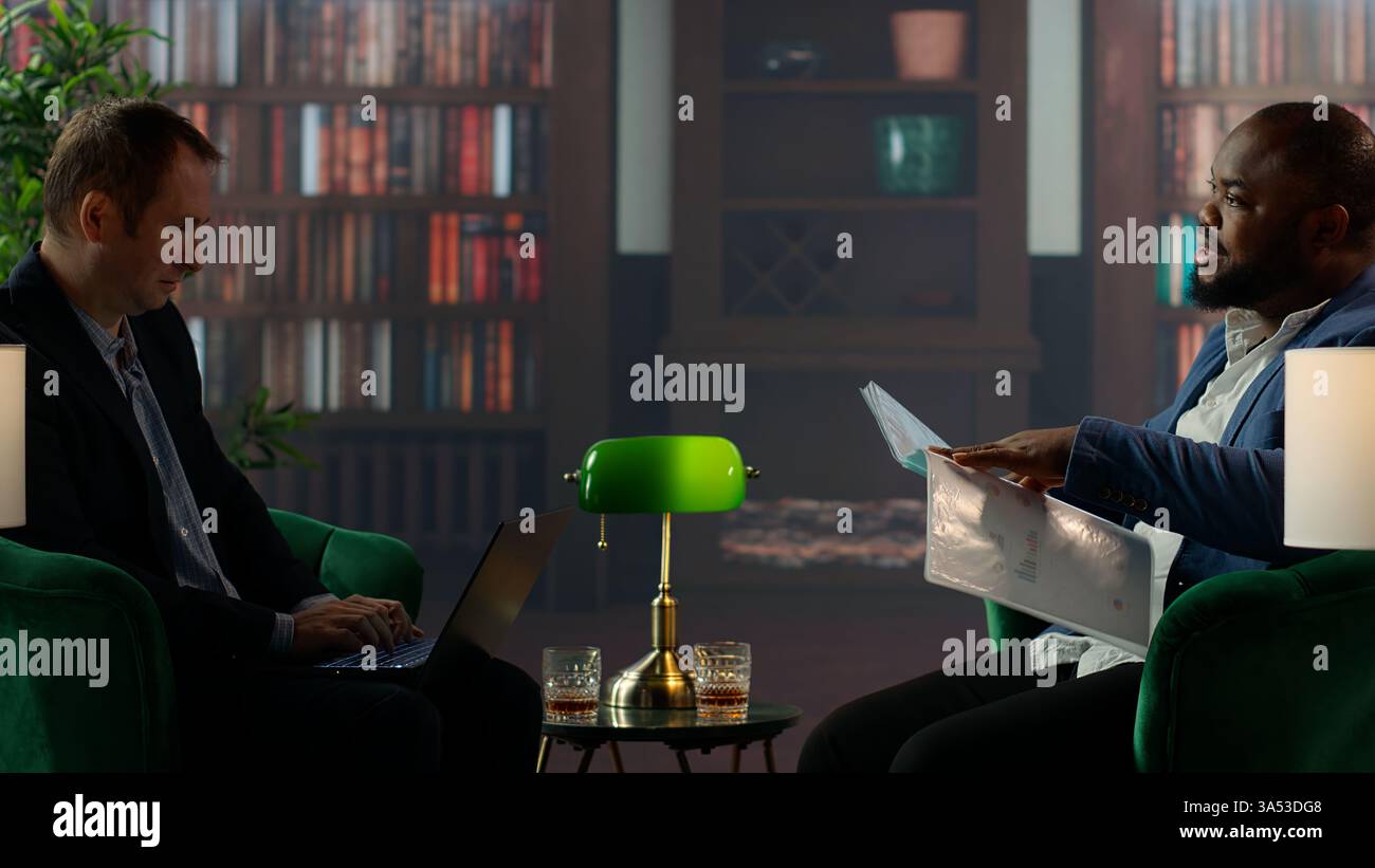 Secret service staff reviewing classified documents over whiskey ...