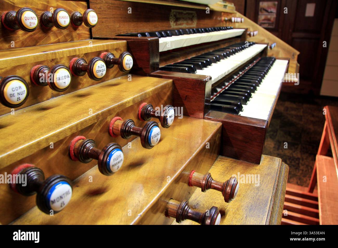 Keyboards and pedals of church's pipe organ in France Stock Photo - Alamy