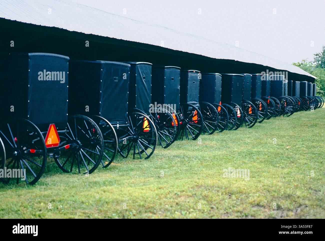 Horse drawn buggies parked at Mennonite Meeting House; church ...