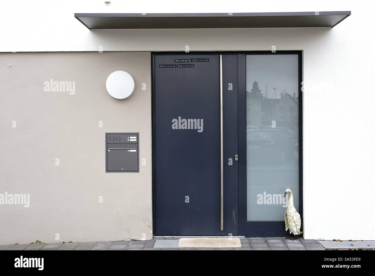 The angular and modern entrance to a residential building with a steel ...