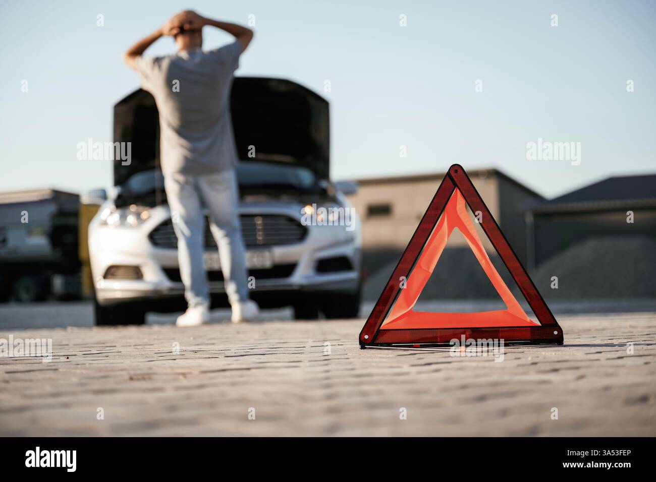 Unfortunate, transport is broken, red sign. Man is with his car ...