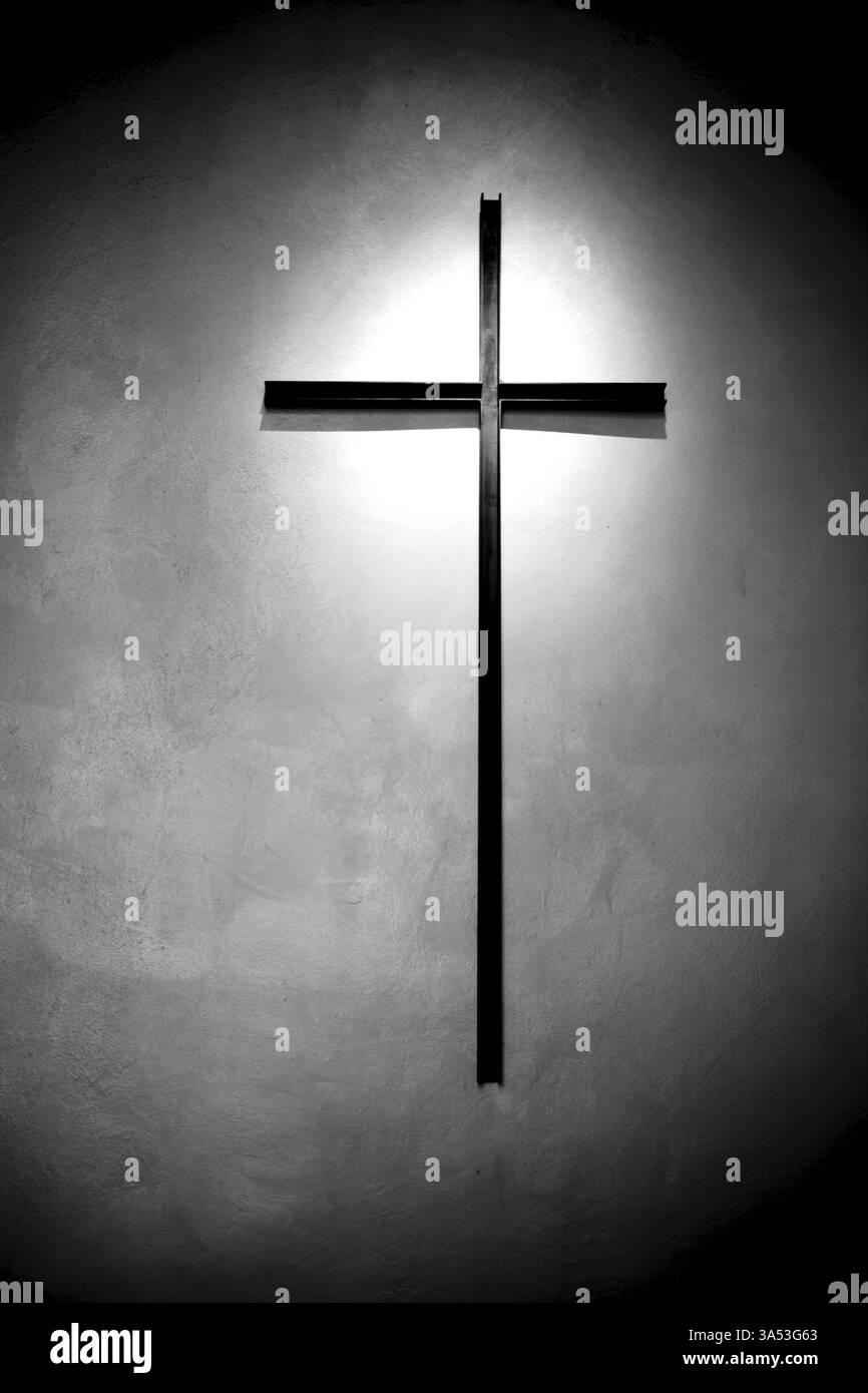 In a dark crypt, a ray of light shines directly onto the centre of a ...