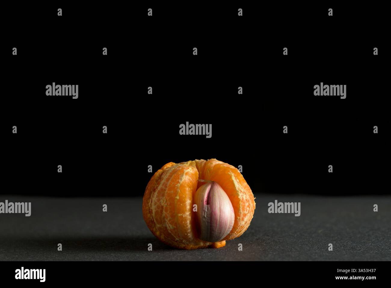 Concept being in the wrong place not fitting in head of garlic with a ...