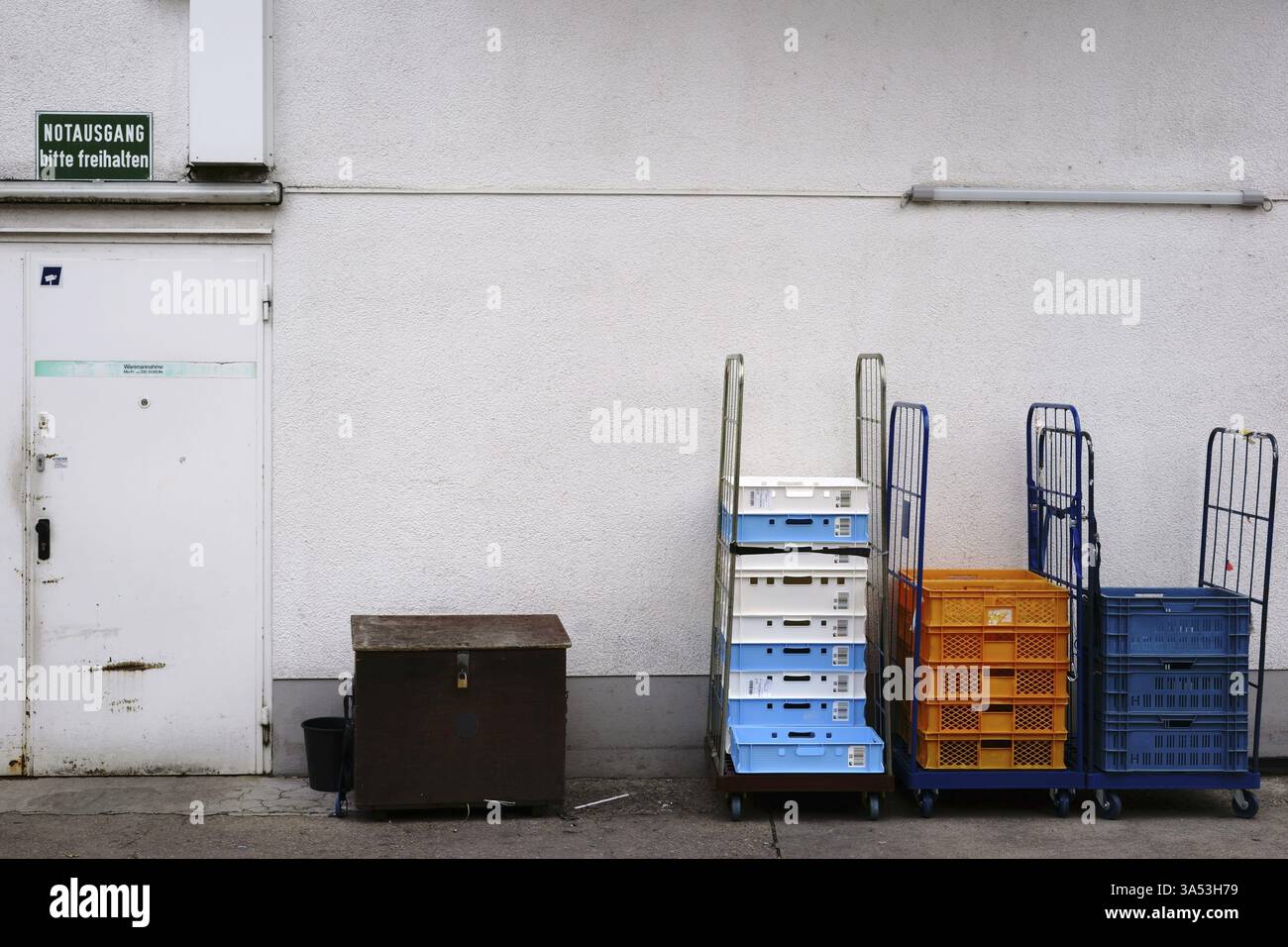 A goods receiving area at the rear entrance of a grocery shop with ...