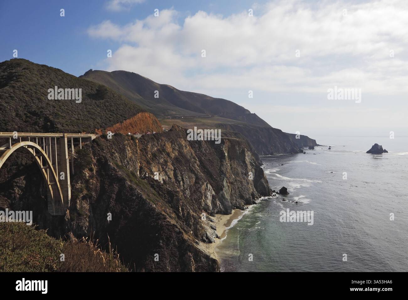 The magnificent bridge on a coastal motorway of rocky and steep Pacific ...