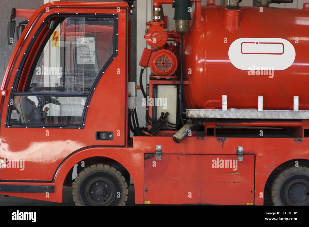 Close-up of the red body and the water tank of a fire engine or small ...