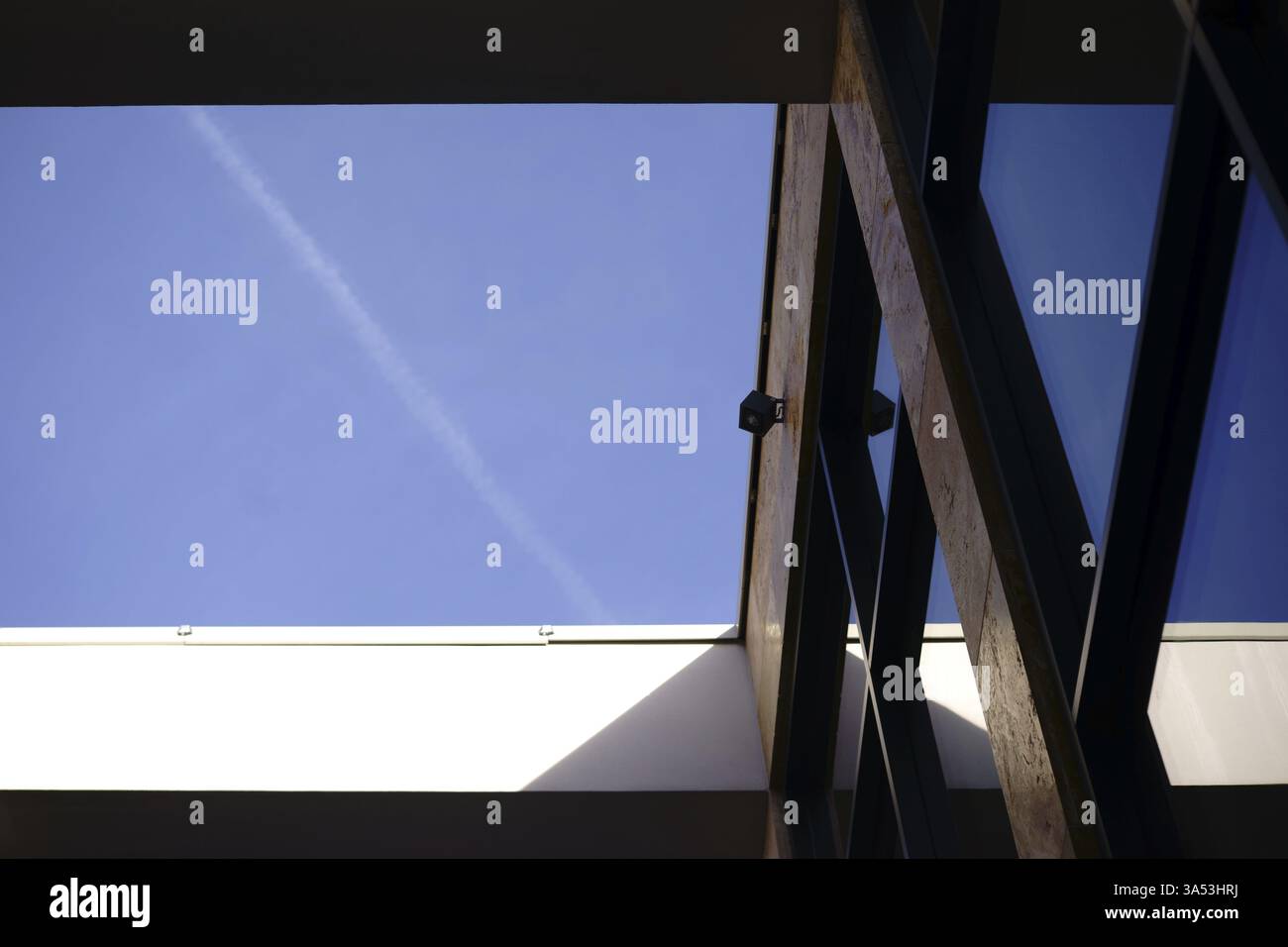 The modern glass facade of a modern building with a steel structure and ...