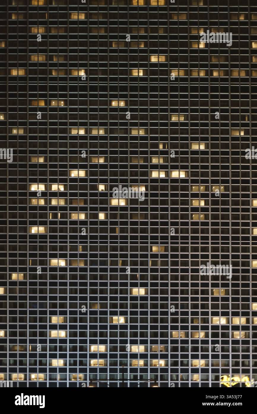 The modern facade and exterior wall of a high-rise building with glass ...