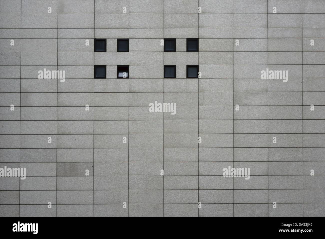 The modern facade of a modern shopping and commercial building with ...