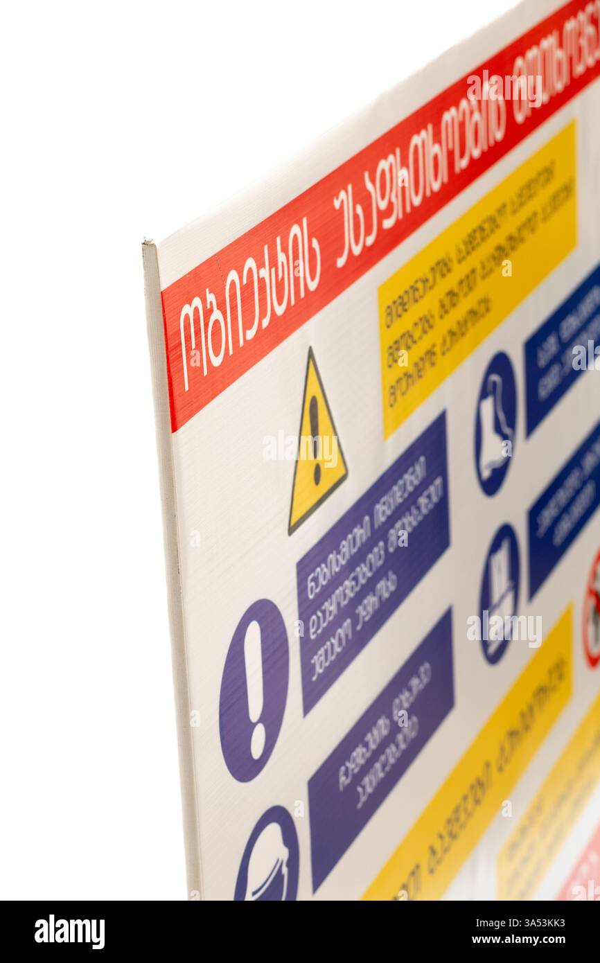 A detailed safety warning sign displaying crucial information for ...