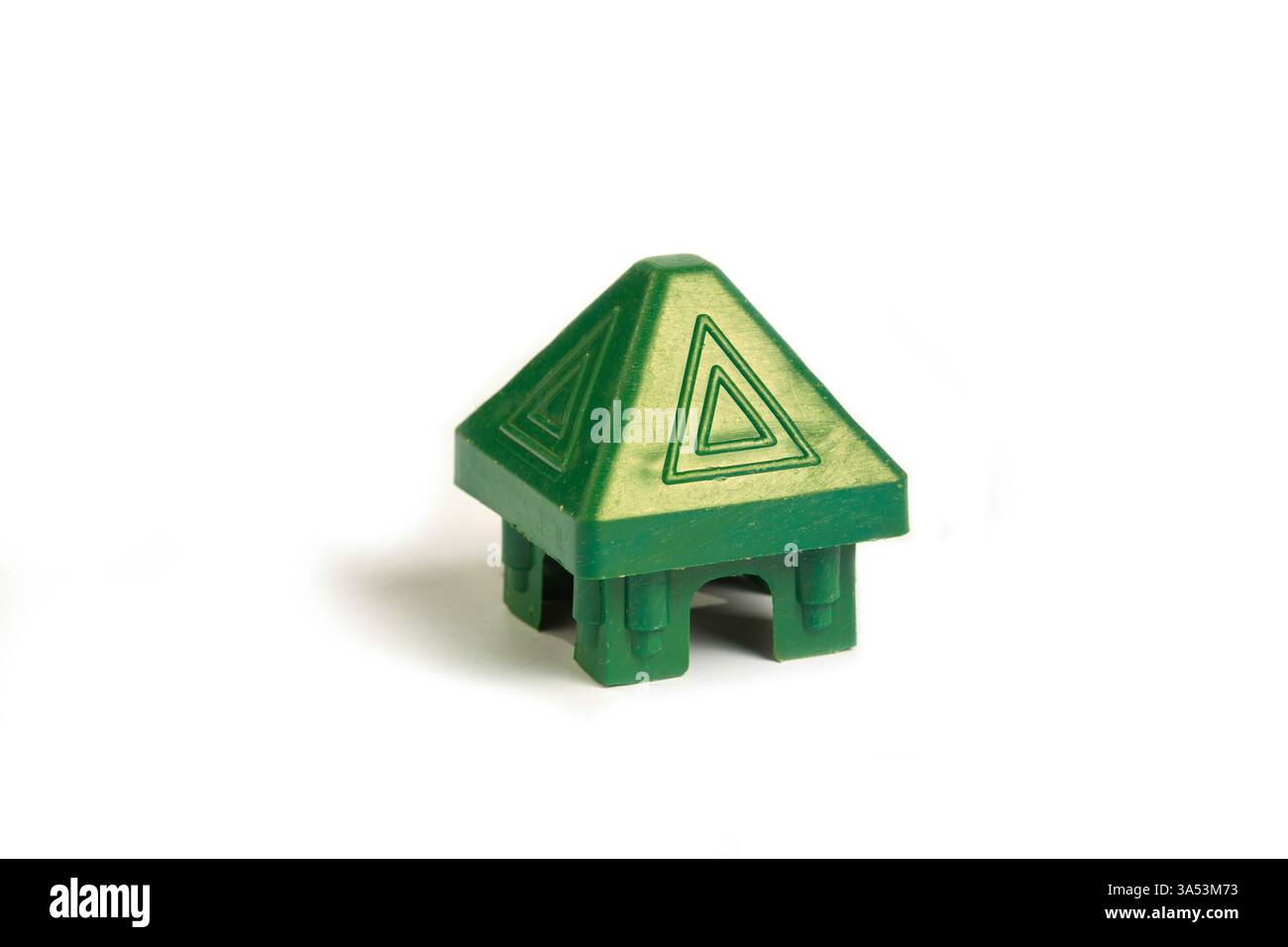 A Vibrantly Green Toy Piece Featuring a Pyramid Shape with Intricate ...