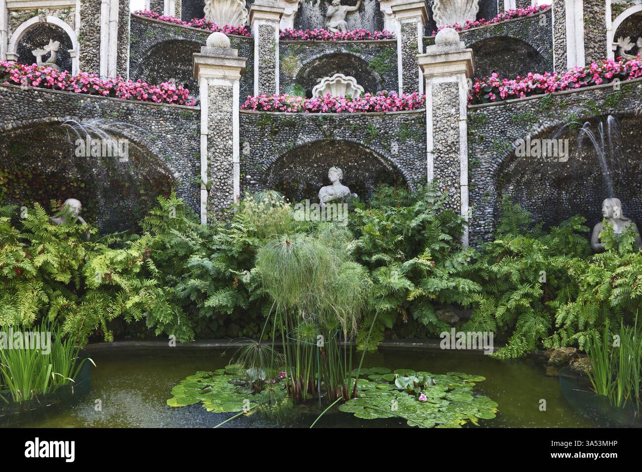 Magnificent palace, pond and fountain in beautiful well-groomed park ...