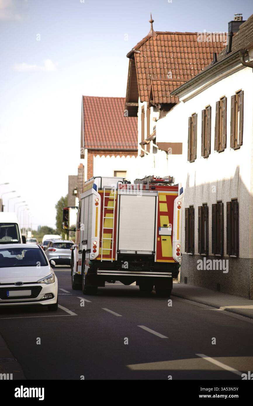 Two fire engines drive quickly over a bridge during a firefighting ...