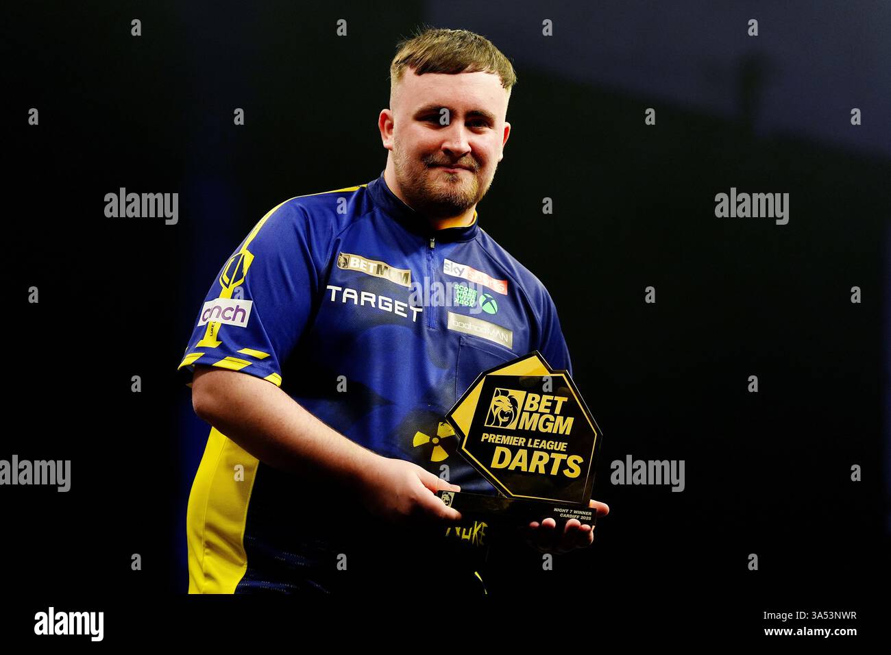 Luke Littler poses with the trophy after winning night seven of the ...