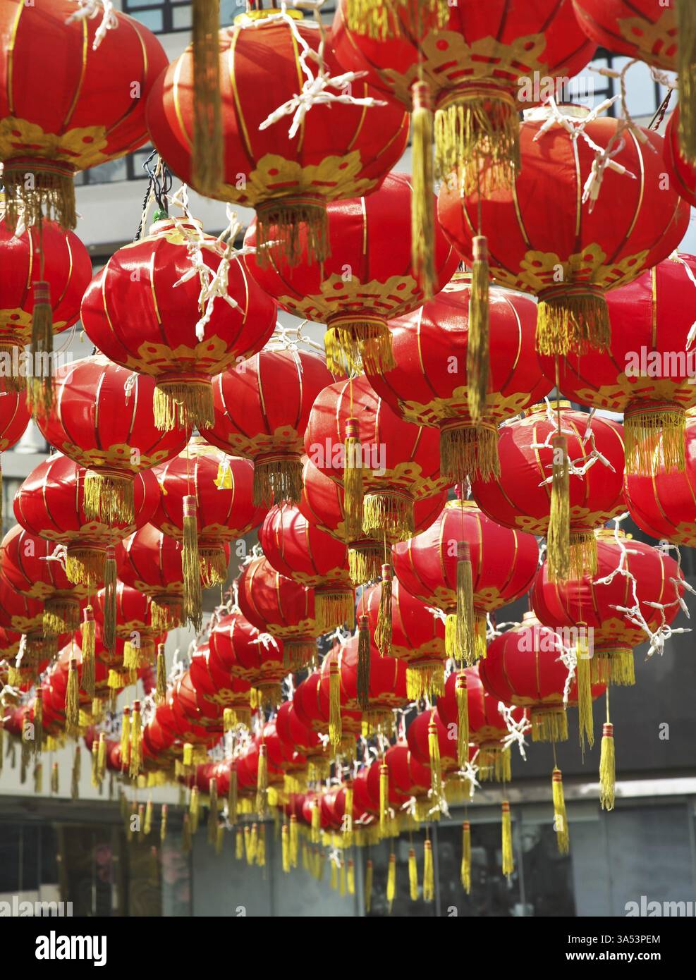 The traditional red lanterns decorating modern skyscrapers, in the ...