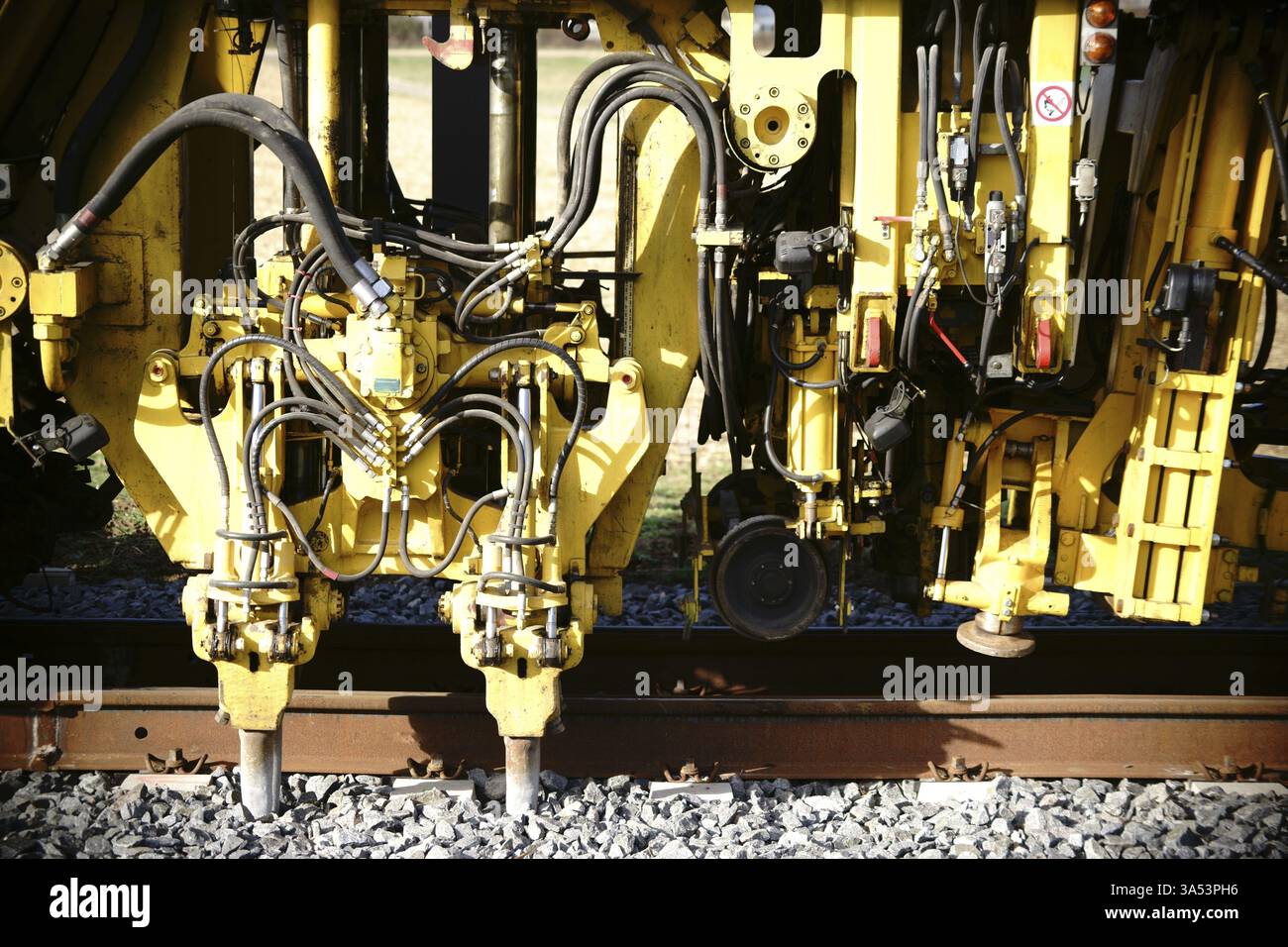 Close-up of the hydraulics and lifting cylinders of a tamping machine ...