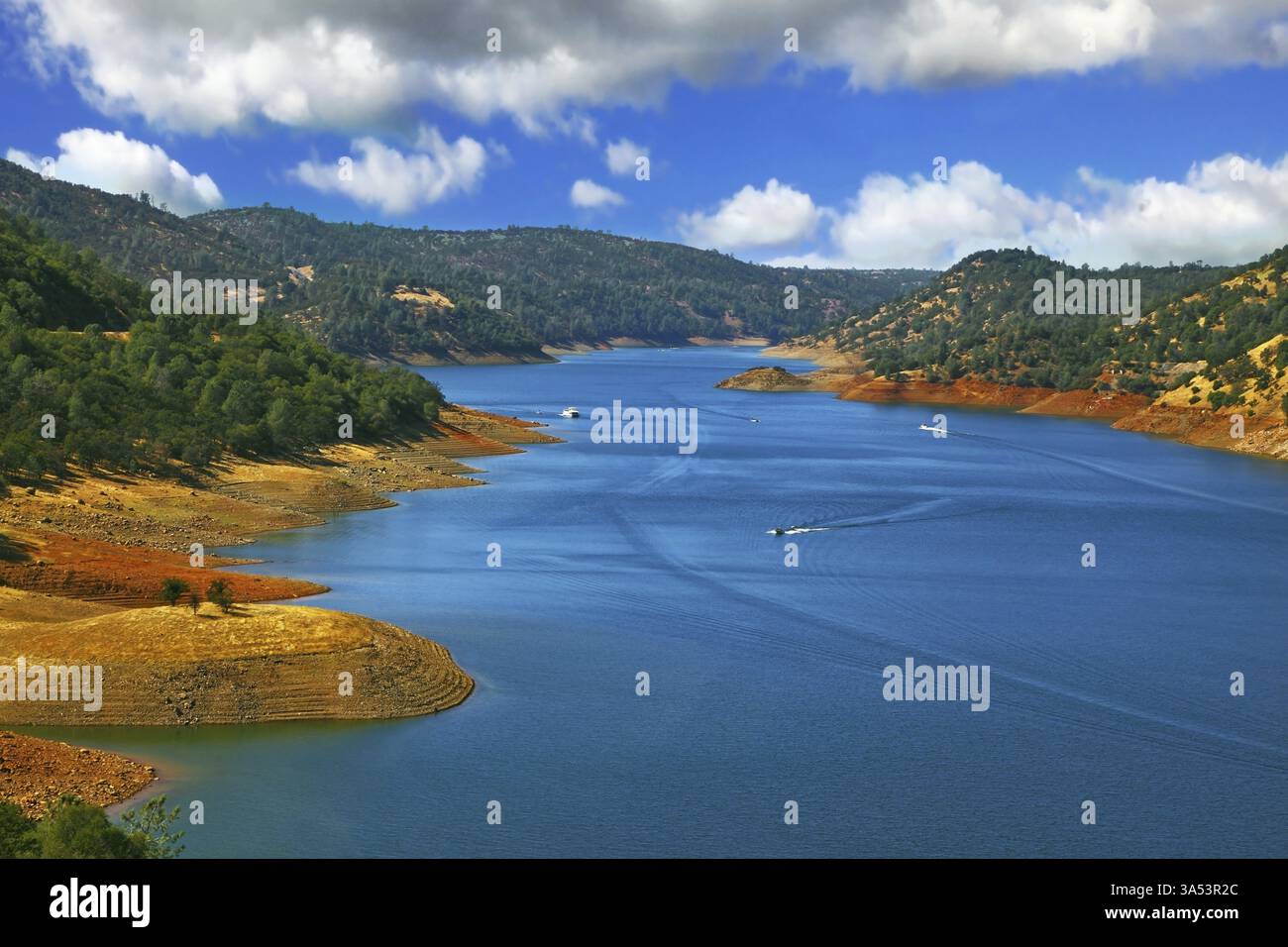 Bright dark blue water and the charming rounded off sandy coast of the ...