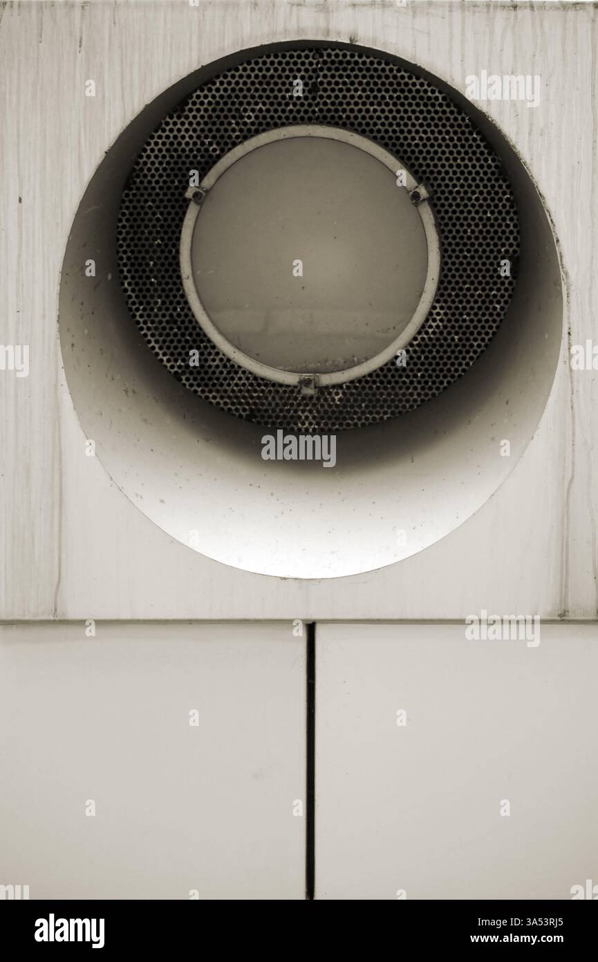 The underside view of a vent on the roof edge of an industrial building ...