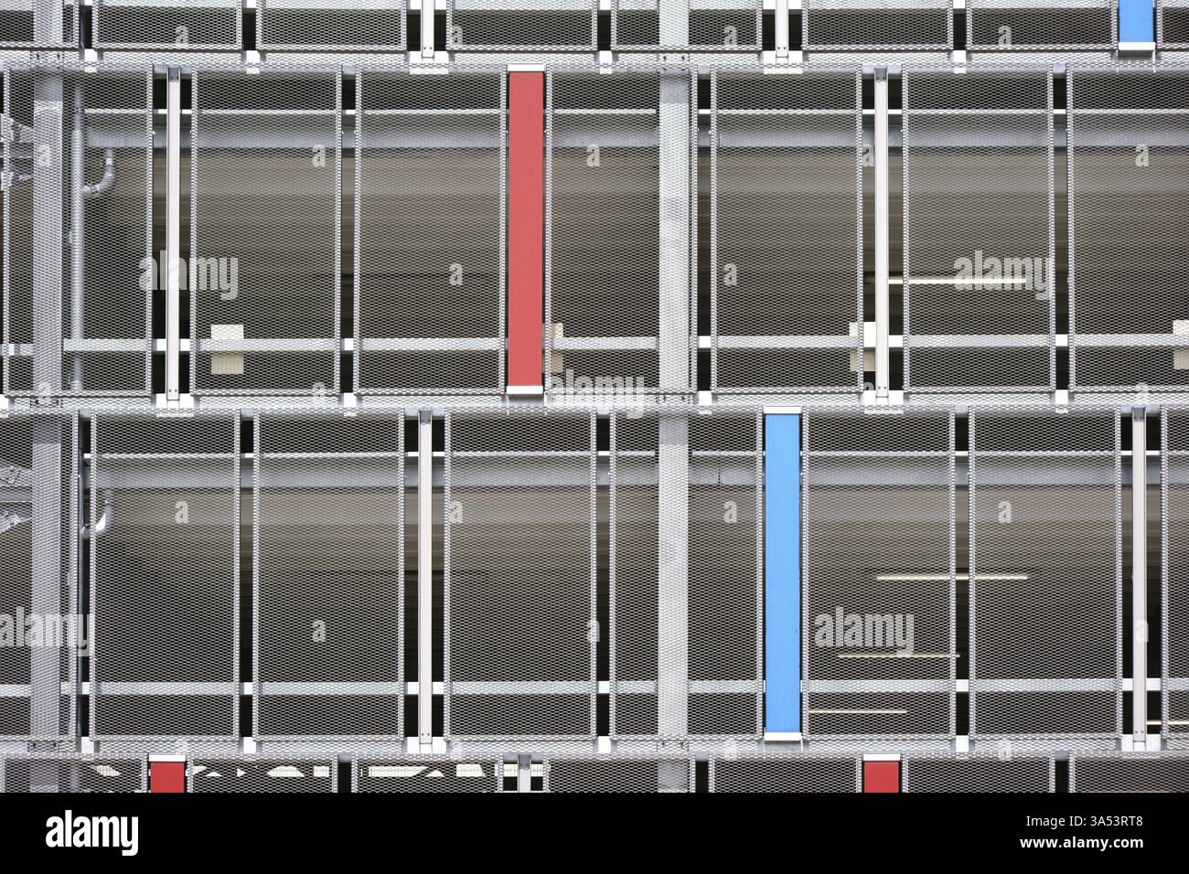 An open multi-storey car park with several parking decks protected by ...