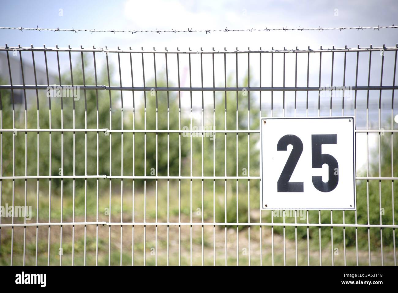 The detail of a lattice fence with the numbering of a plot fenced in ...