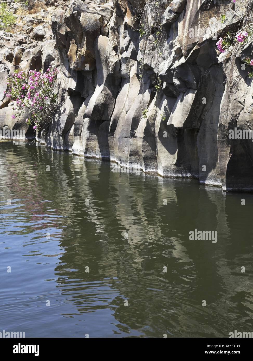 Mountain stream between vertical walls from cut basalt Stock Photo - Alamy