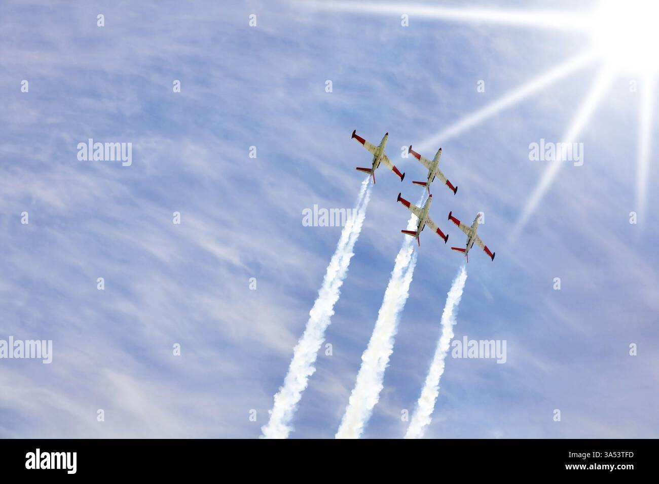 Synchronous delightful flight of four sparkling planes on air parade ...