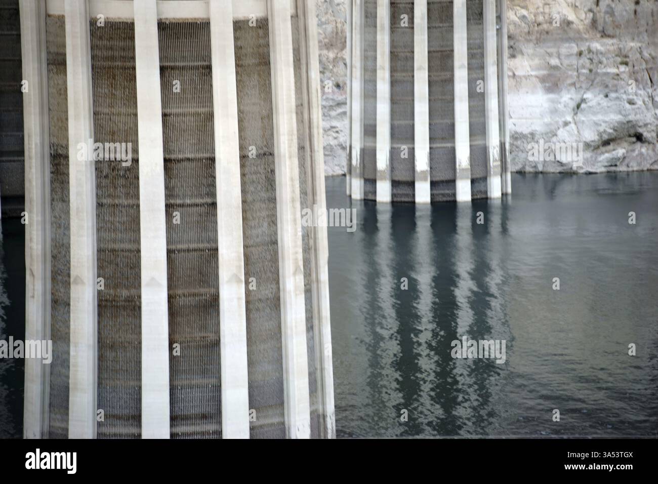 Close-up of water intake towers of the Hoover Dam in front of rocks ...