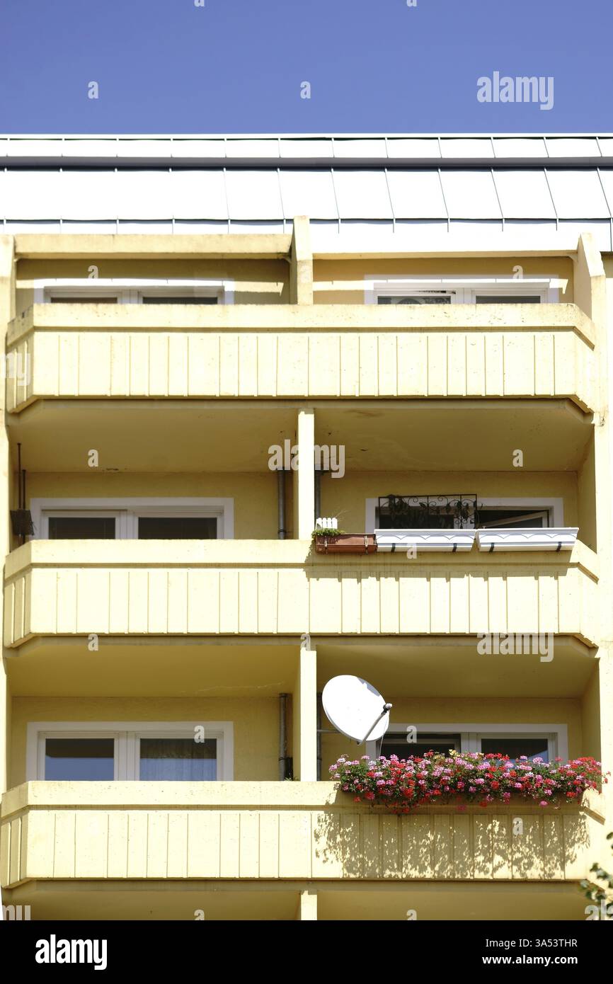 Nostalgic balconies with satellite dish and flower boxes of an old ...