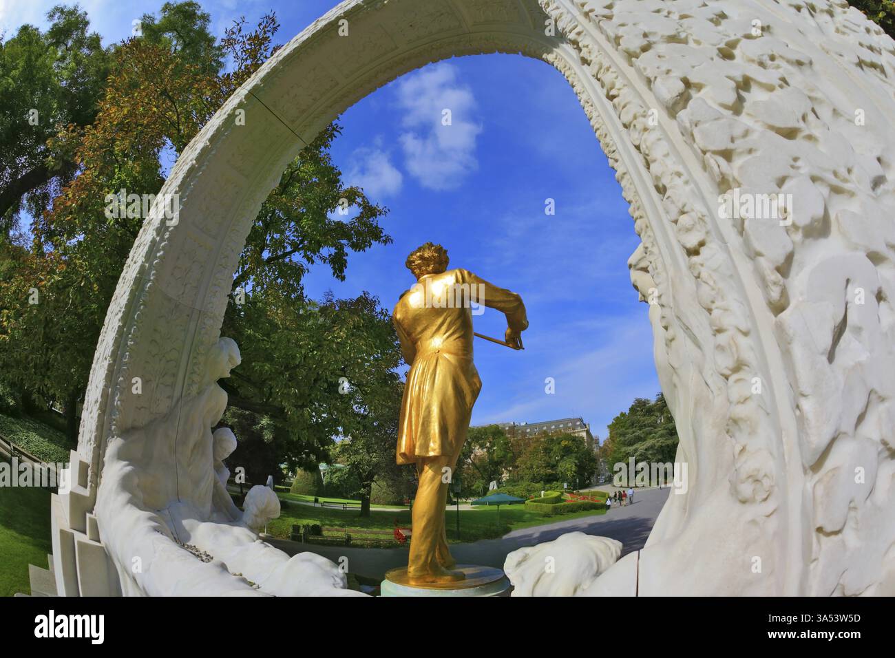 Elegant bronze statue with violin shines in the bright summer sun ...
