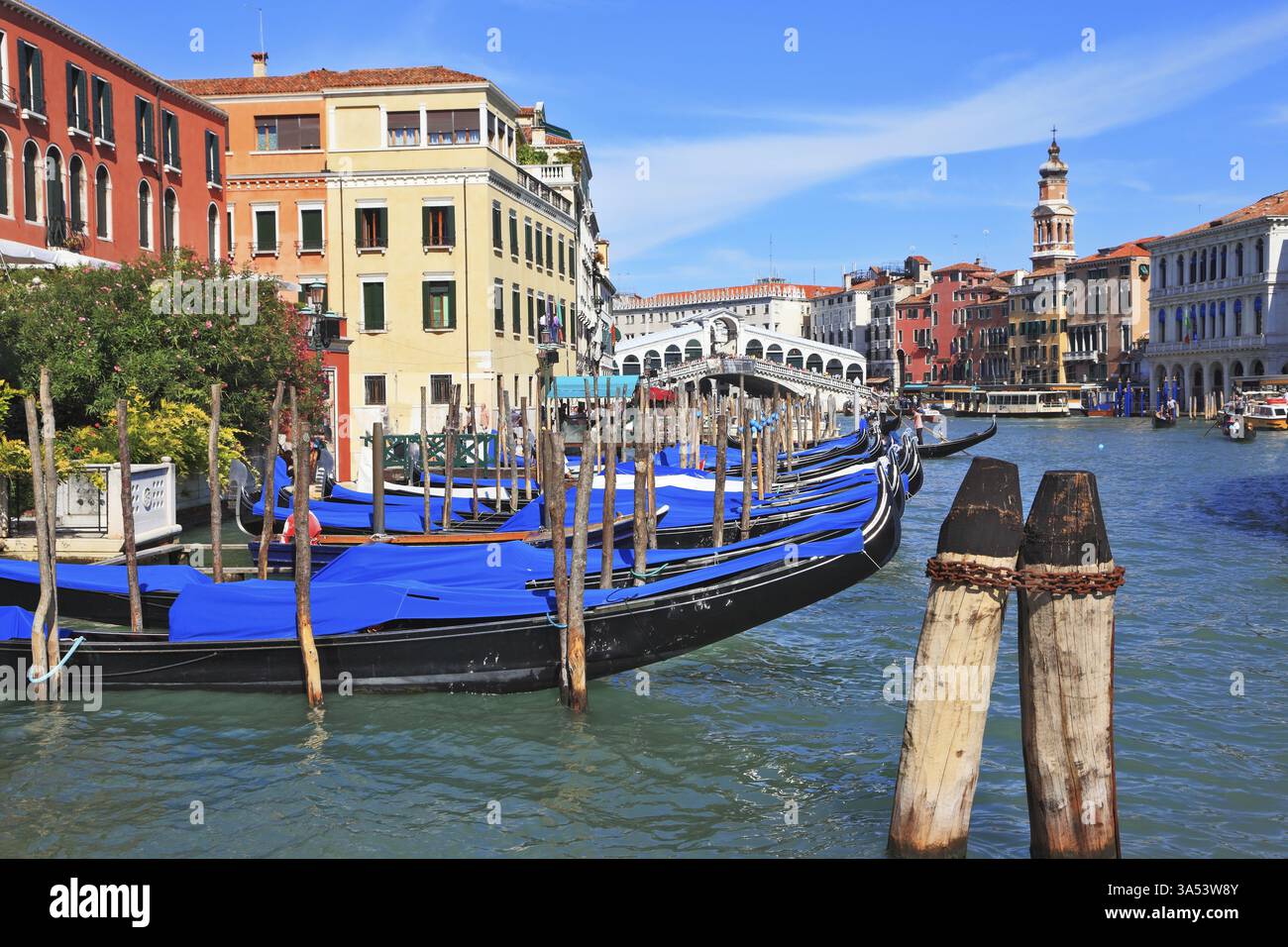 The famous Grand Canal in Venice. Graceful black gondolas wait for ...