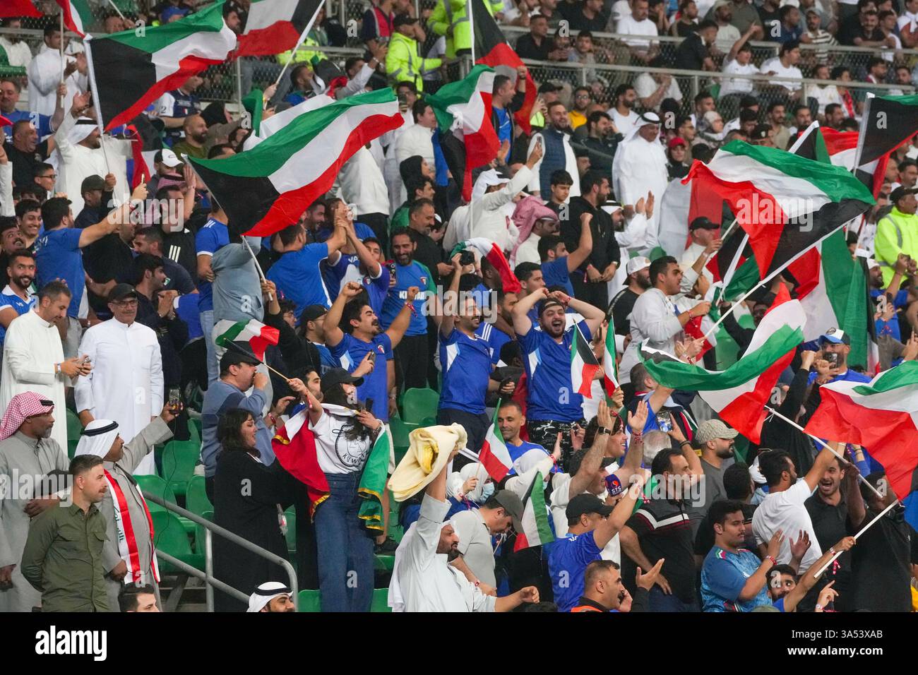 Kuwait soccer fans cheer for their team during the Asian qualifier group B match for the 2026 ...