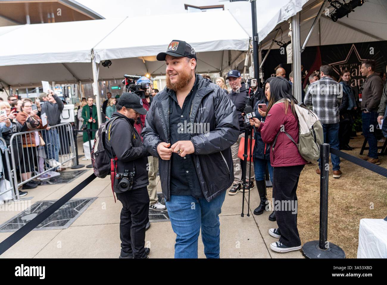 Luke Combs interacts with fans during the ceremony honoring Luke Combs ...
