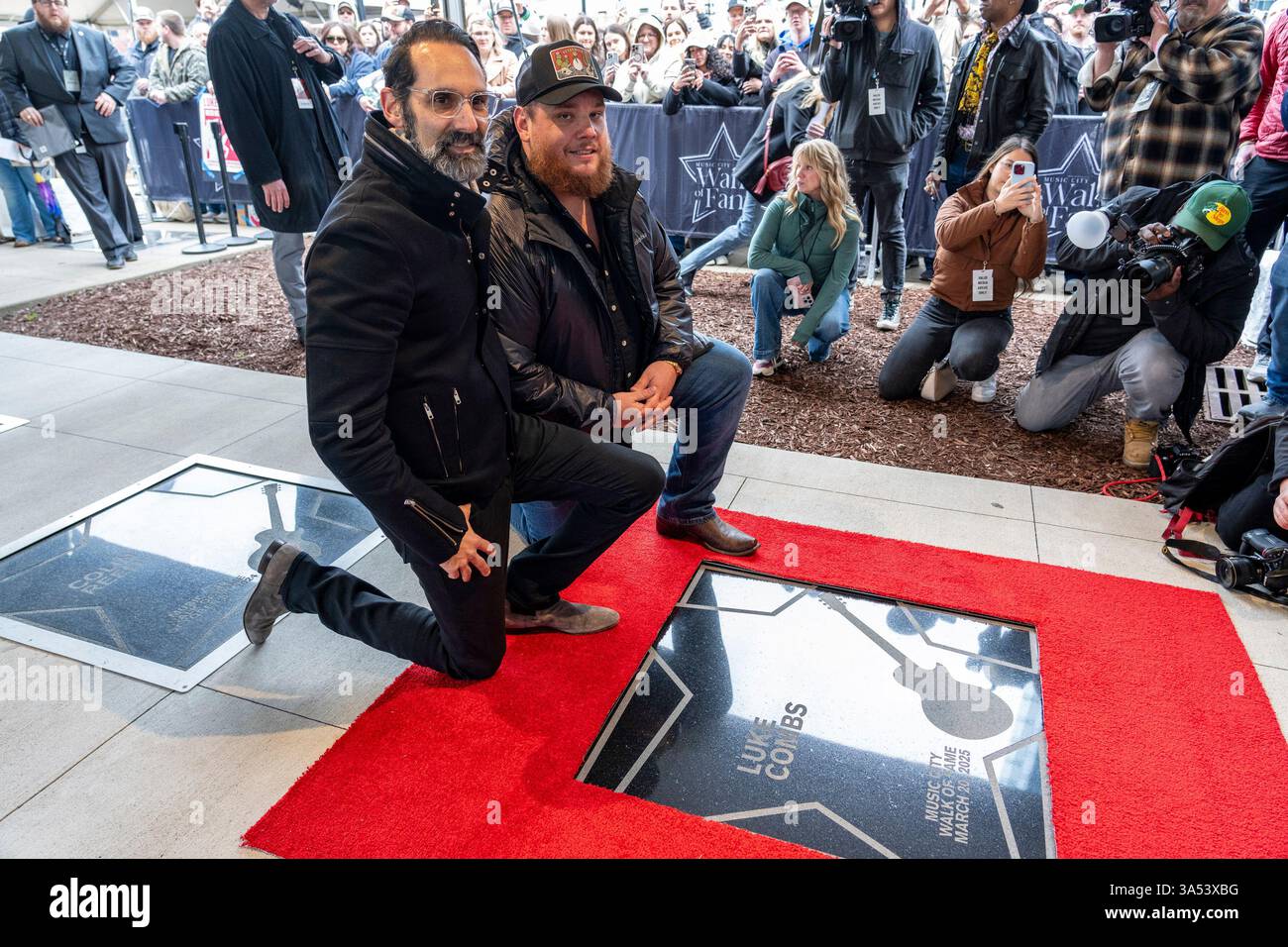 Gibson CEO Cesar Gueikian, left, and Luke Combs attend the ceremony ...