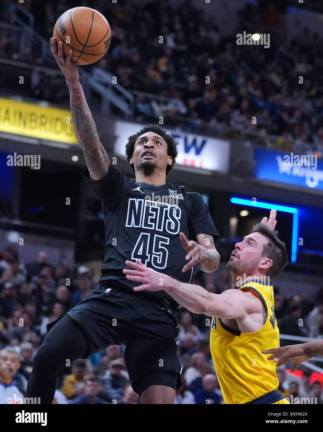 Brooklyn Nets guard Keon Johnson (45) shoots over Indiana Pacers guard ...