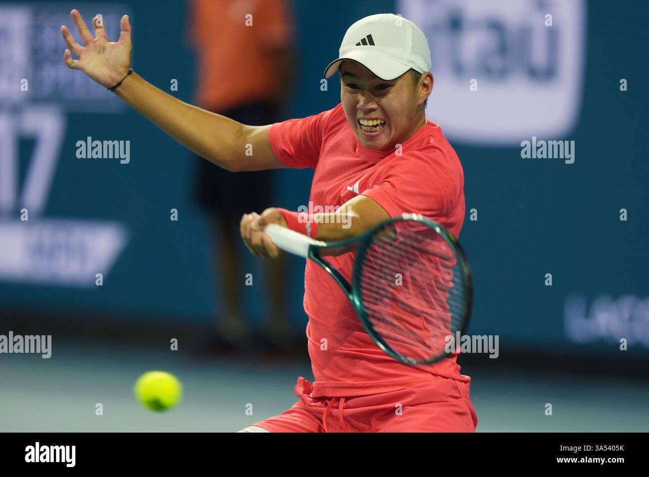 Learner Tien hits a return to Joao Fonseca of Brazil during the Miami Open tennis tournament ...