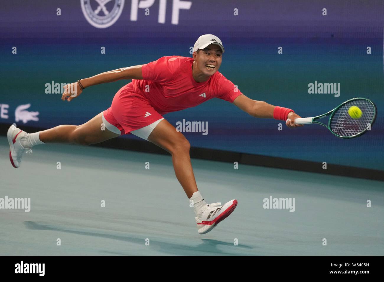 Learner Tien hits a return to Joao Fonseca of Brazil during the Miami Open tennis tournament ...