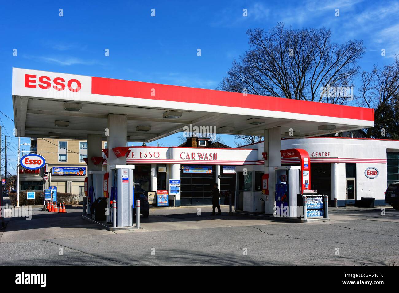 Ottawa, Canada - March 19, 2025: Old fashioned full service Esso station with car wash on Island ...