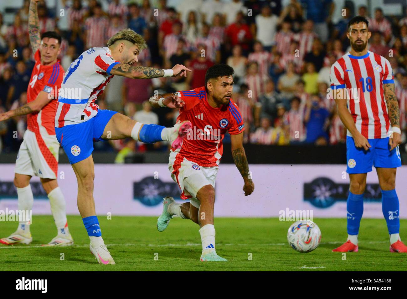 Paraguay's Julio Enciso, left, shoots on goal and fail to score during ...