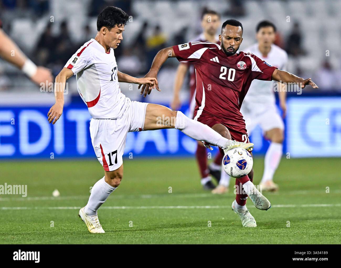 2026 FIFA World Cup Qualifier -Qatar v North Korea Ahmed Fathy of Qatar and Kang Kuk Chol of ...