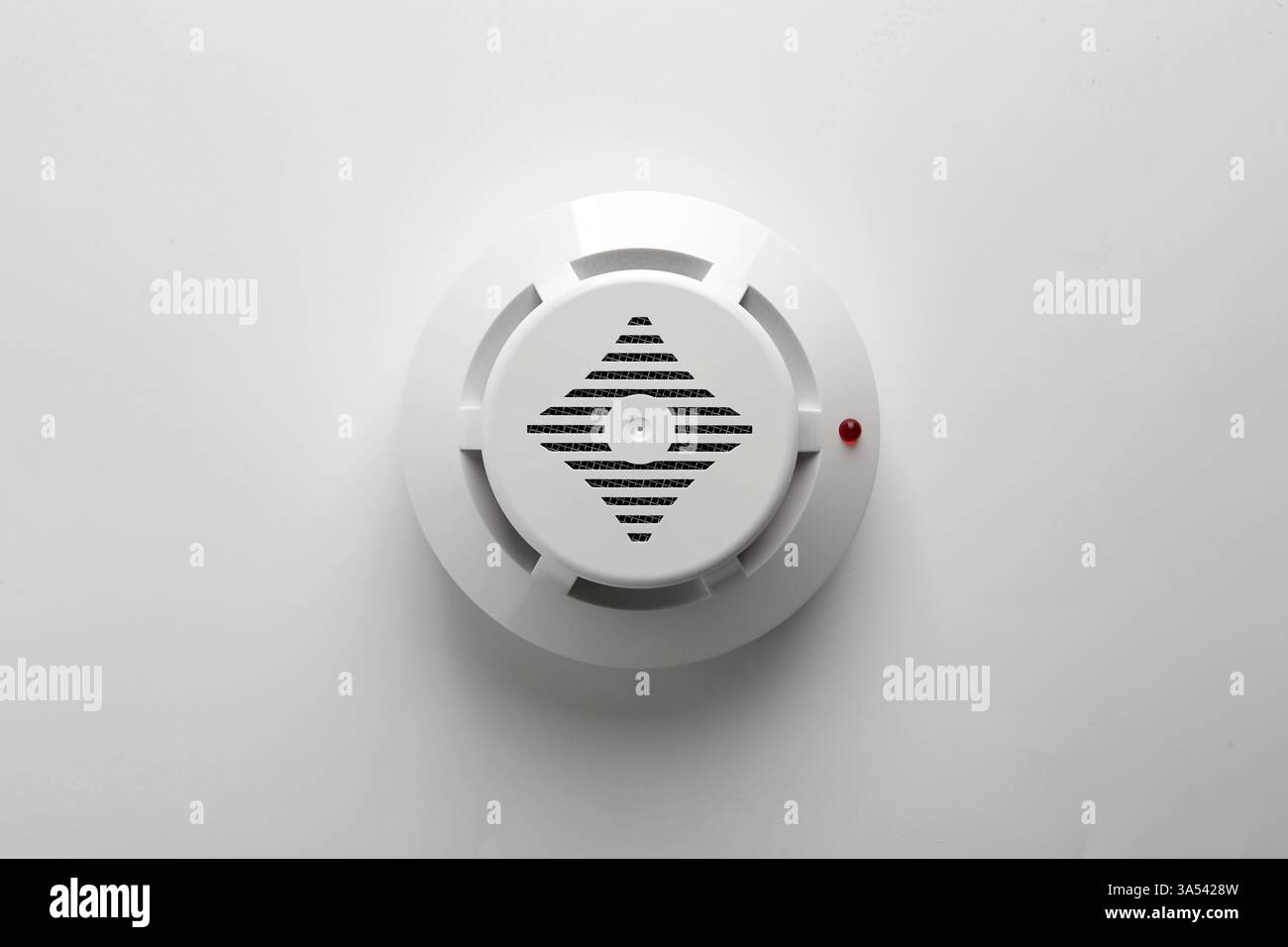 Smoke detector on light background, top view. Alarm system Stock Photo ...