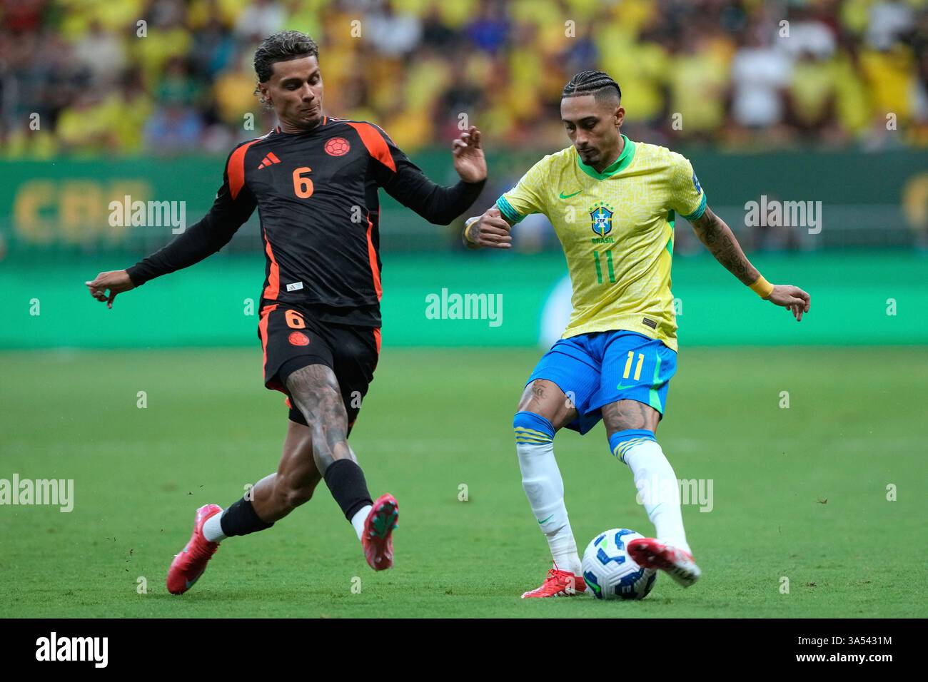 Brazil's Raphinha, right, and Colombia's Richard Rios battle for the ...