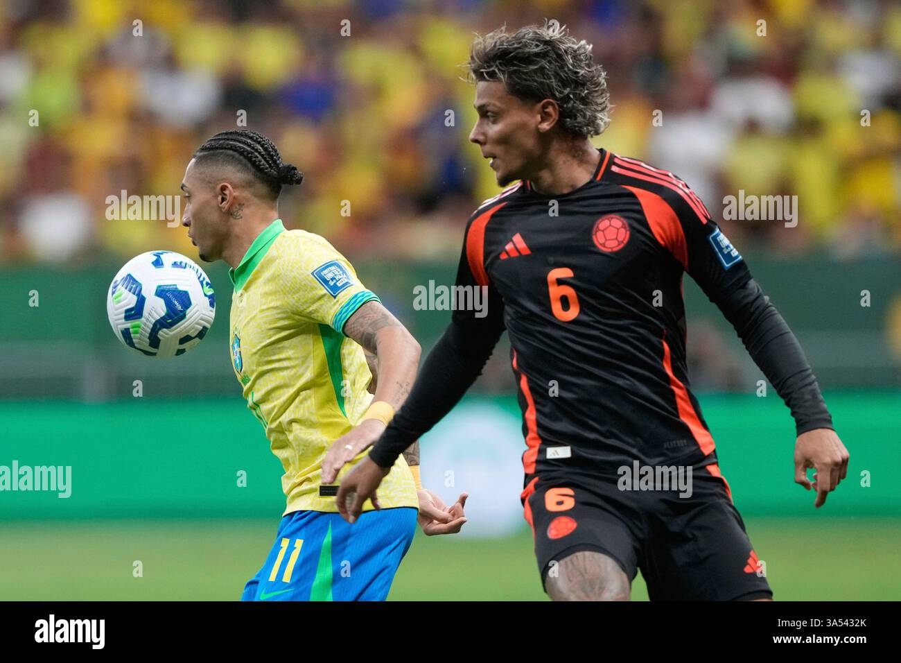 Brazil's Raphinha, left, and Colombia's Richard Rios battle for the ...