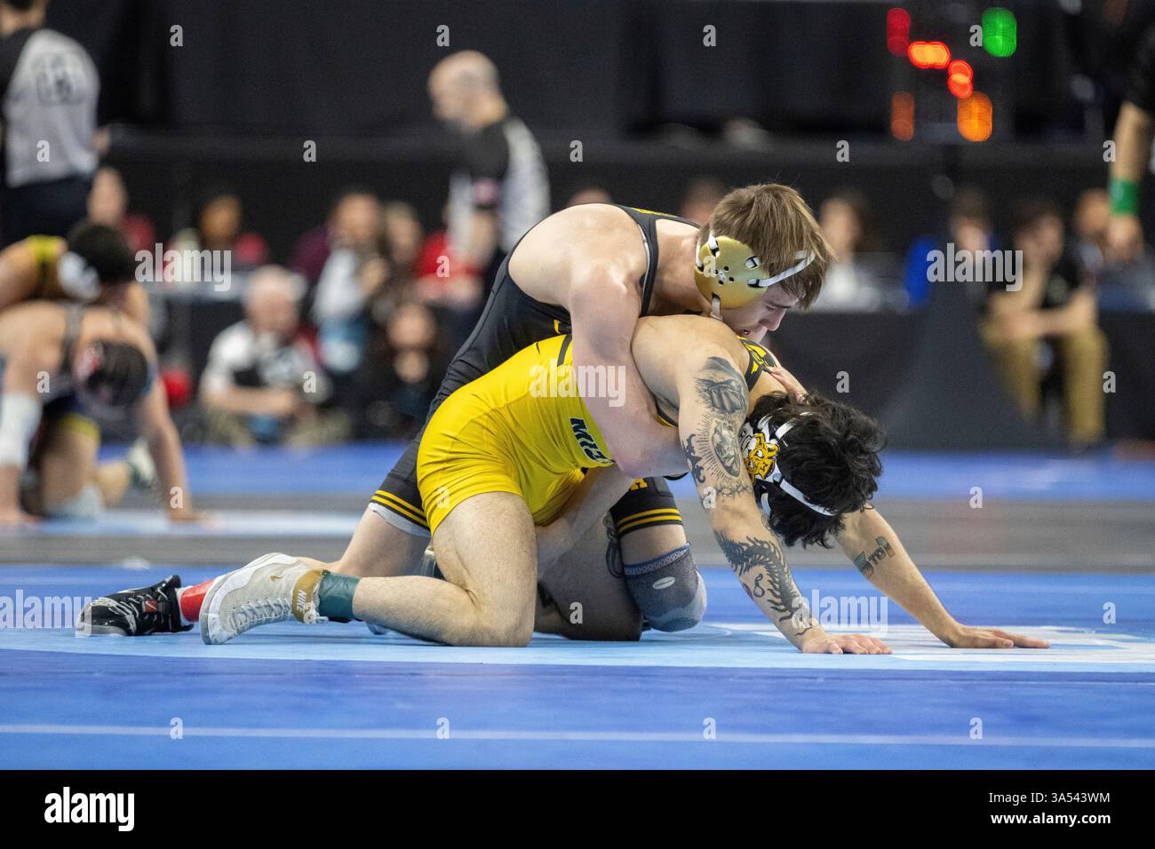 PHILADELPHIA, PA - MARCH 20: Drake Ayala of Iowa and Kade Moore of ...