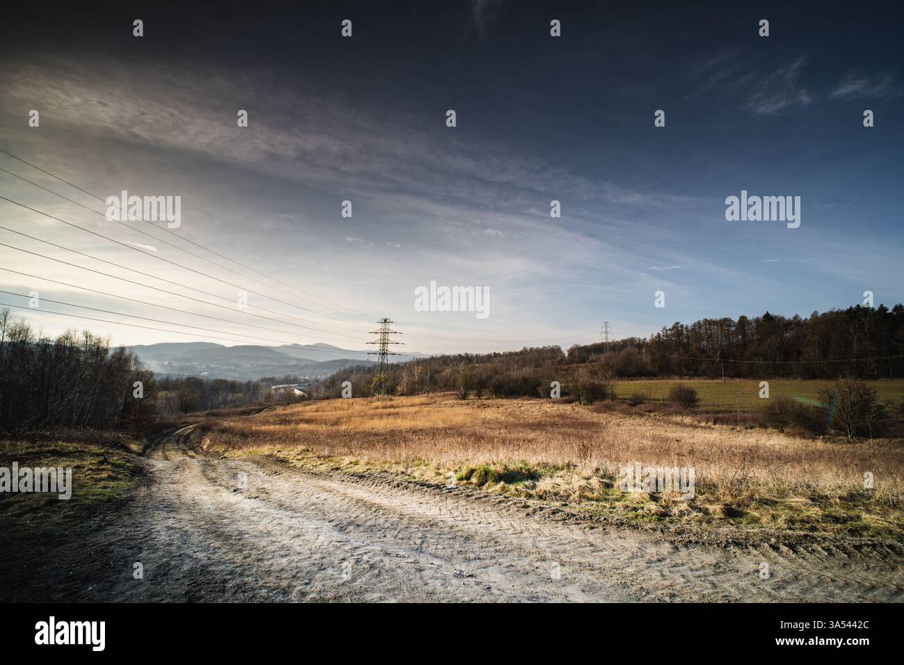 A vast expanse of untamed land stretches into rolling hills, where ...