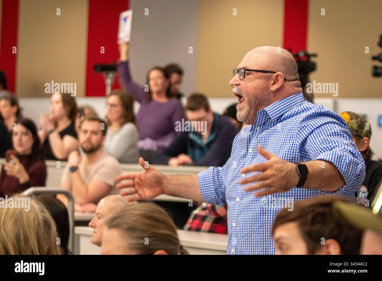 Michael Bretz raises his voice over the commotion to make a comment ...