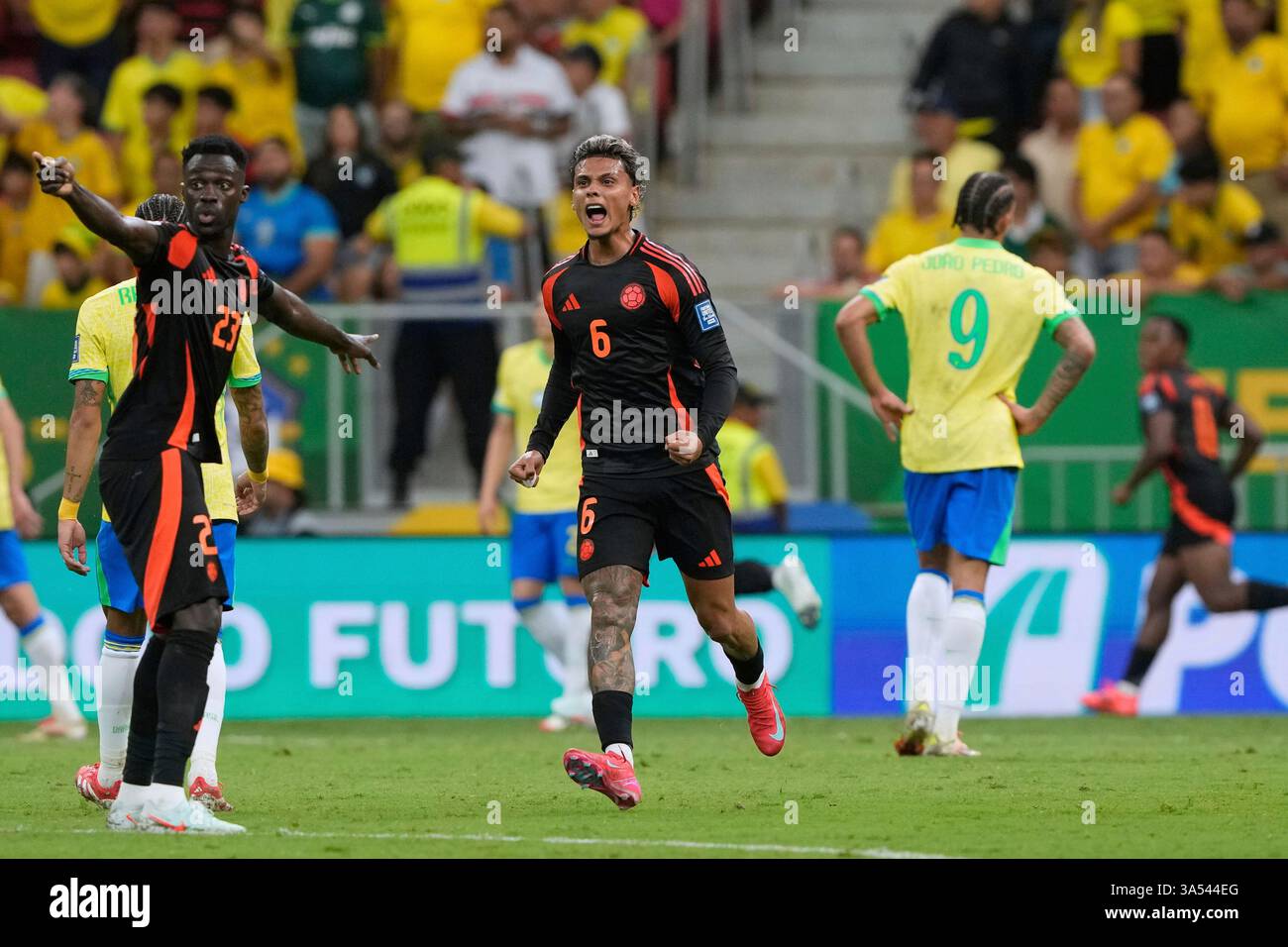 Colombia's Richard Rios, center, celebrates his side's opening goal ...