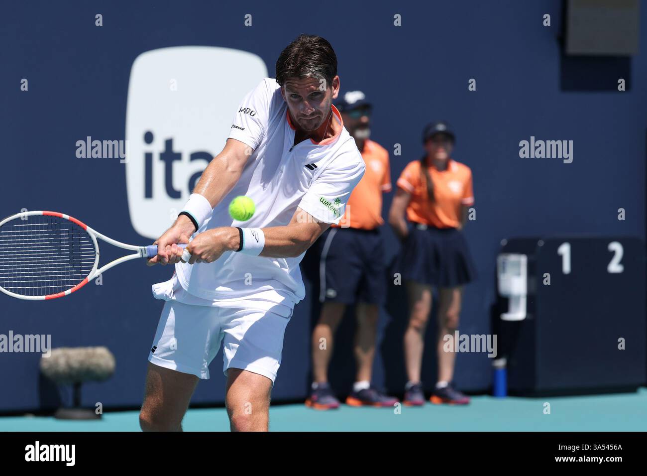MIAMI GARDENS, FLORIDA - MARCH 20: Yunchaokete Bu of China defeats Cameron Norrie of Great ...